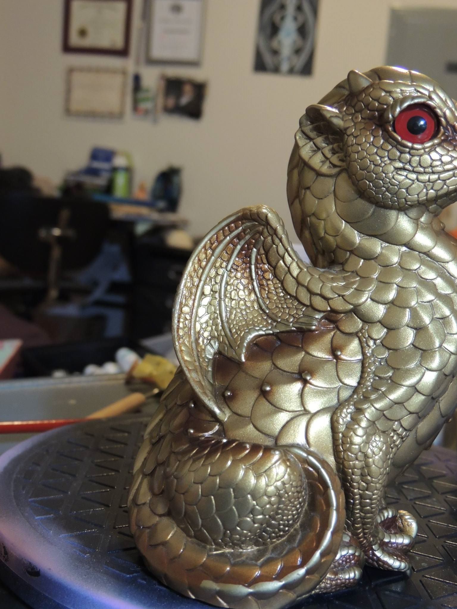 LE Baby Dragon: Had quarter sized chip from wing and chip in eyelid ...